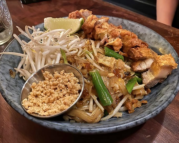 Pad Thai done right is culinary poetry – notice how those noodles remain distinct rather than forming that dreaded starchy tangle.