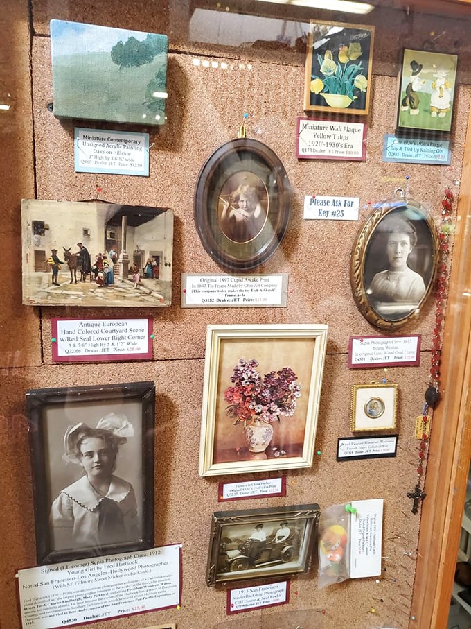 A gallery wall of forgotten faces and faded memories. These portraits once held places of honor in someone's parlor; now they await new admirers.