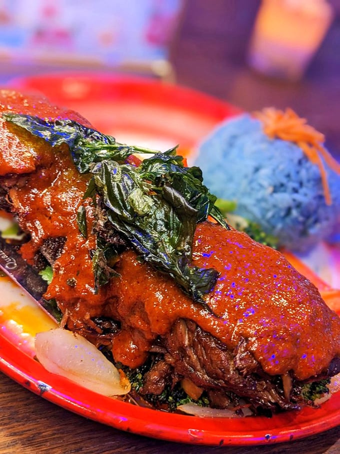 Panang beef that makes you question every other curry you've ever had—the crispy basil leaves adding textural contrast that elevates the entire experience.