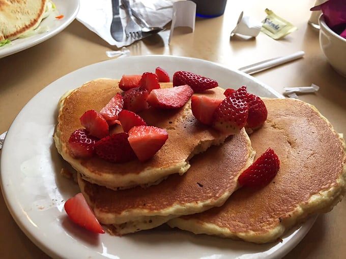 These fluffy pancakes crowned with fresh strawberries could make even the grumpiest morning person smile.