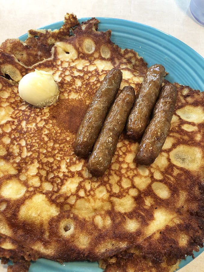 The pancake that launched a thousand food pilgrimages—thin, crispy-edged, and large enough to make your plate disappear.
