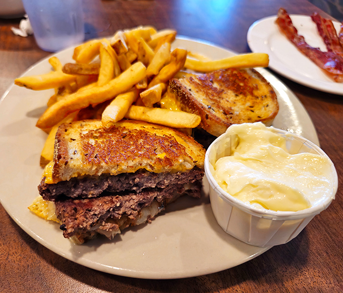The patty melt – that brilliant marriage of burger and grilled cheese – arrives with fries that clearly weren't an afterthought.