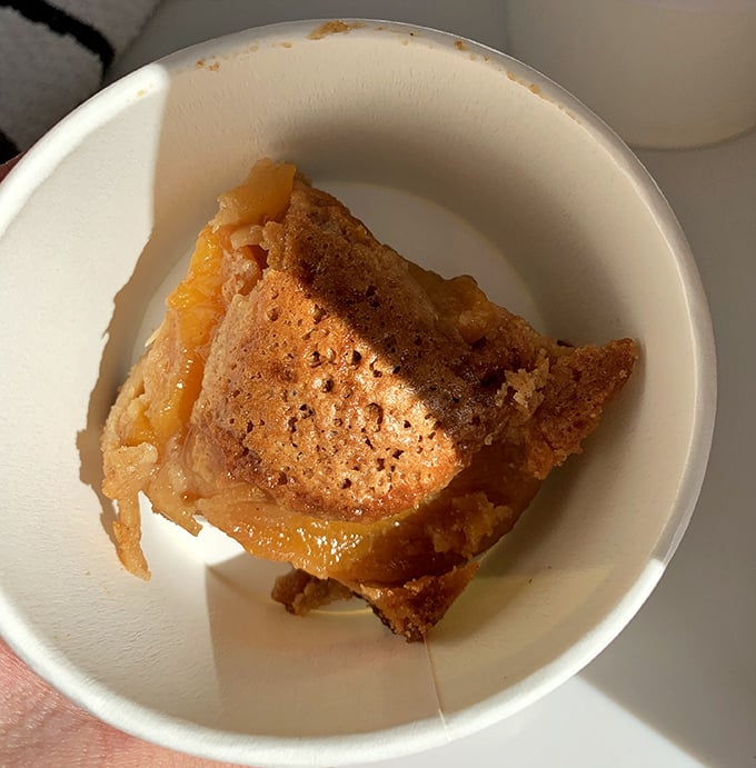This peach cobbler isn't just dessert – it's summer sunshine captured in a bowl, with a golden crust that shatters just right under your spoon.