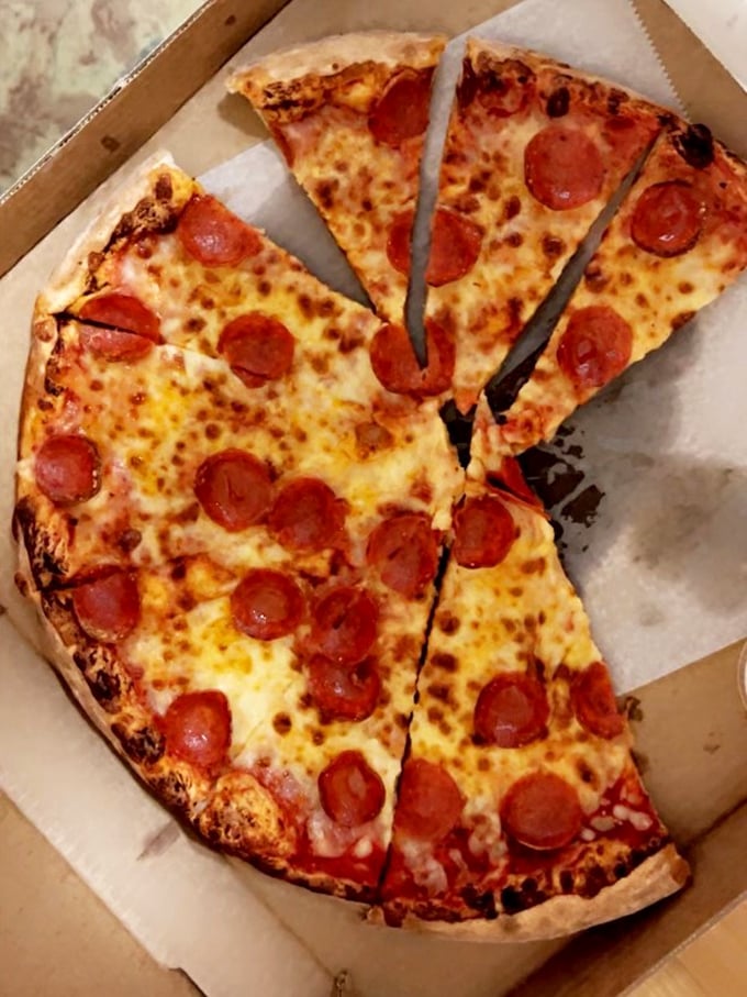 The pepperoni pizza doesn't just have toppings—it has personality. Each slice boasts the perfect ratio of sauce, cheese, and those crispy-edged pepperoni cups.
