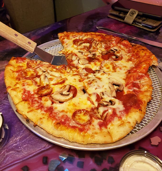 This isn't just pizza – it's a perfectly proportioned canvas where mushrooms and pepperoni play starring roles in a melty masterpiece.
