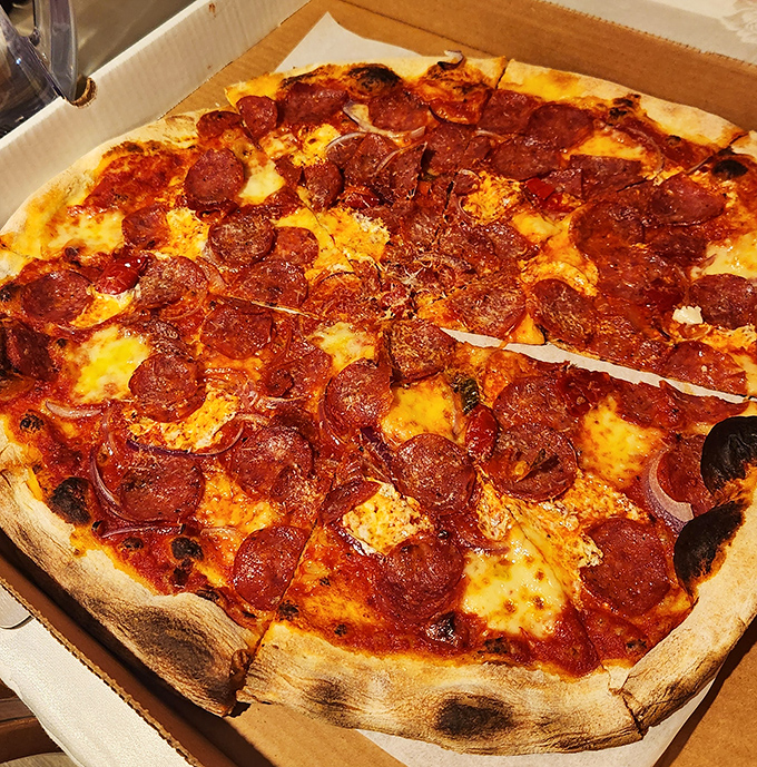 This pepperoni pizza doesn't just have toppings – it has personality. Each cup-shaped pepperoni holds a tiny pool of delicious possibility.