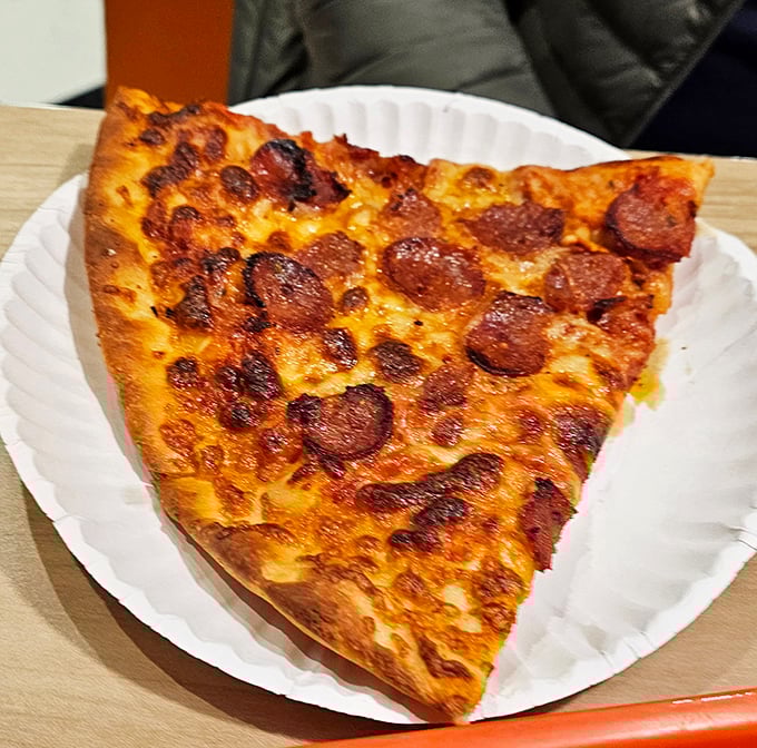 Pepperoni that curls into crispy cups, creating little pools of flavor that make this slice worth crossing state lines for.