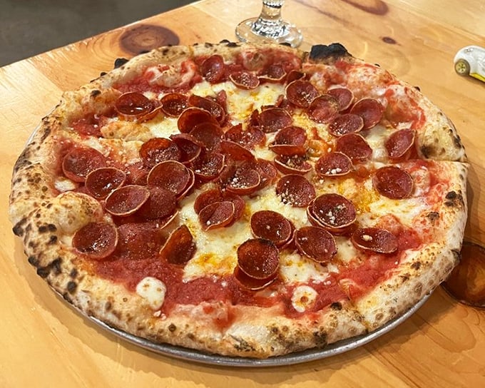 Pizza perfection isn't complicated: a blistered crust, bright sauce, molten cheese, and pepperoni that curls into little cups of savory joy.
