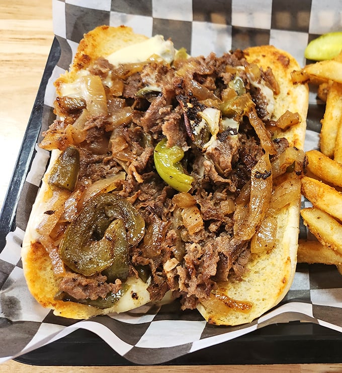 The Philly cheesesteak that would make Philadelphians nod in respect. Tender beef, melted cheese, and those perfectly caramelized peppers and onions—a holy trinity of flavor.