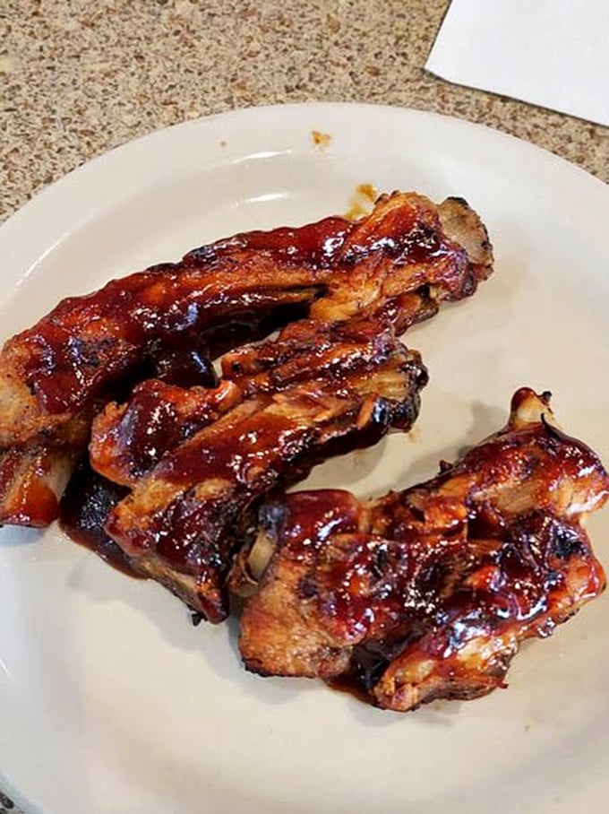 BBQ ribs glistening with sauce that's traveled to all the right places – sticky fingers are the price of admission to flavor town.