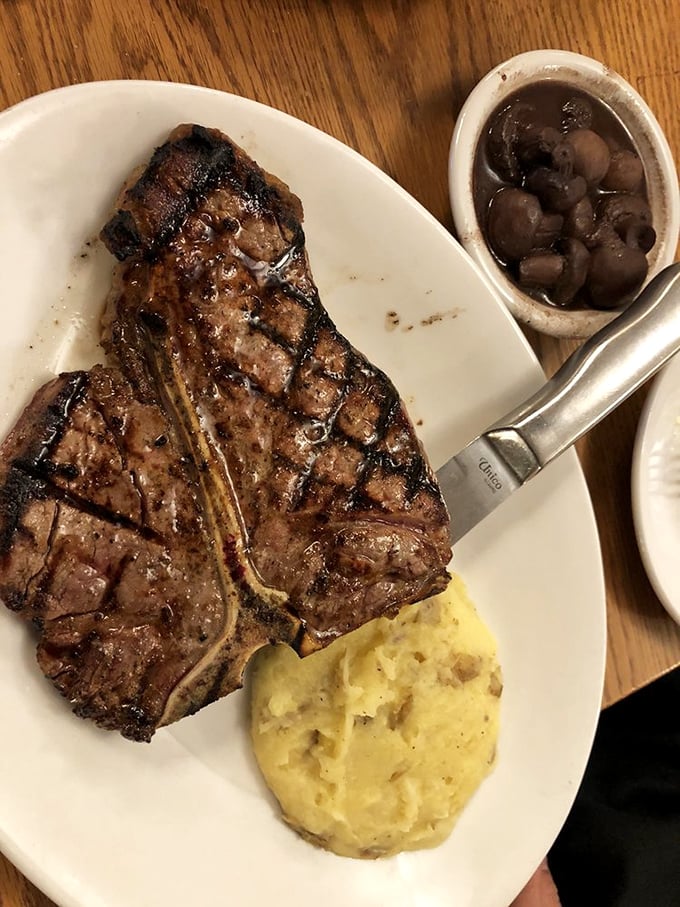 This porterhouse doesn't just sit on the plate—it commands it, with those mushrooms and sauce playing delicious supporting roles.