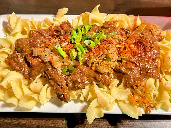 Pot roast that doesn't just fall apart—it surrenders completely, waving the white flag after hours of slow-cooking perfection.