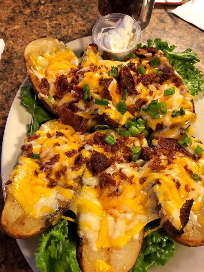 Loaded potato skins that don't mess around—cheese melted to perfection, bacon bits aplenty, and green onions adding that perfect fresh finish.