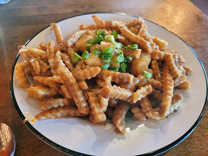 Poutine that proves fries, gravy, and cheese are the holy trinity of comfort food enlightenment.
