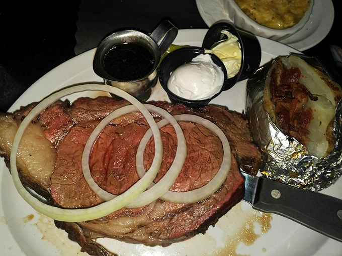 Prime rib that's been kissed by smoke and adorned with onion rings—proof that sometimes the simple pleasures are the most profound.