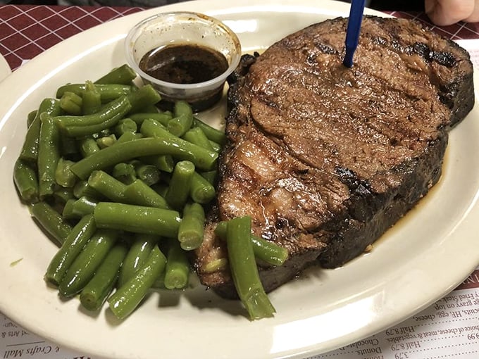 A steak that doesn't need a fancy steakhouse setting to shine. Those green beans aren't just a garnish—they're fighting for the spotlight.