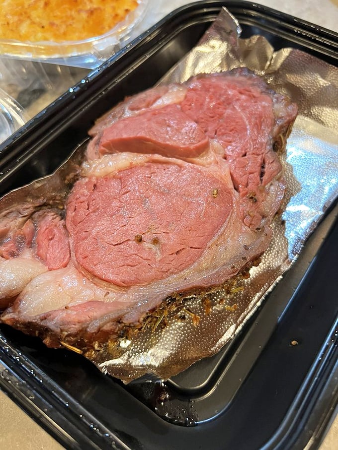 Prime rib that makes you question why you've wasted time eating lesser meats. The juices pooling beneath are liquid gold.