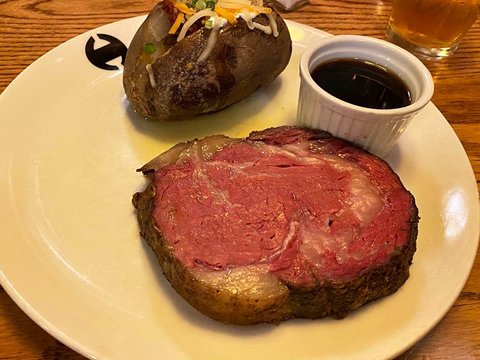 Prime rib so perfectly pink it makes you wonder if blushing beef should be its own food group, served with a potato that's dressed for success.