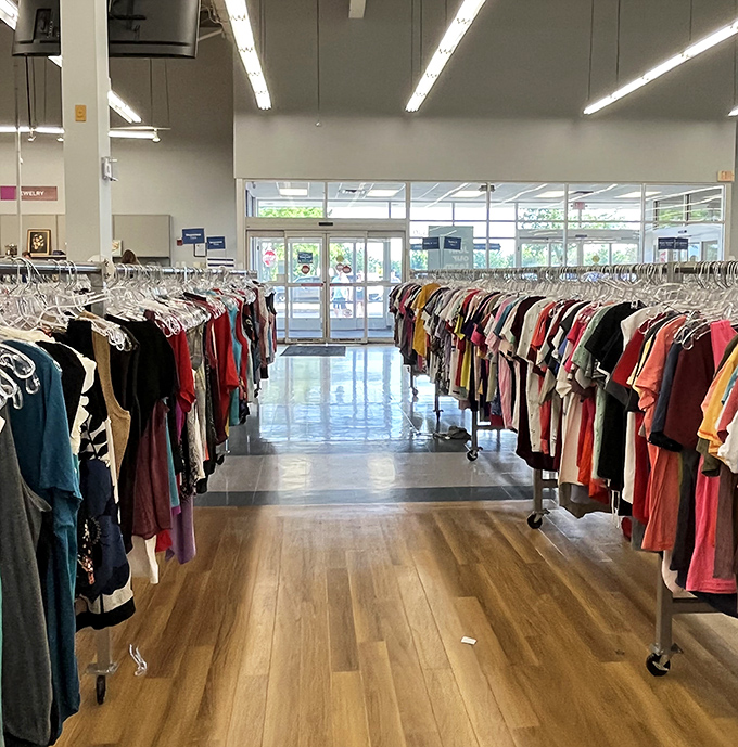 The clothing aisles stretch toward infinity, a textile ocean where vintage band tees mingle with last season's mall brands in perfect harmony.