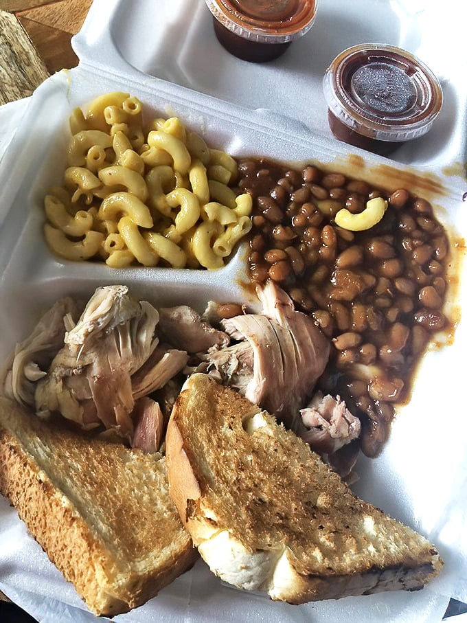 The holy trinity of Southern comfort: mac and cheese, baked beans, and pulled chicken. Add Texas toast and you've got a meal worth crossing state lines for.