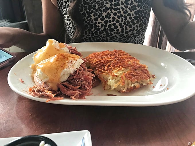 This isn't just pulled pork—it's pork that's been coaxed, sweet-talked, and gently convinced to reach its full potential. Those hash browns deserve their own fan club.