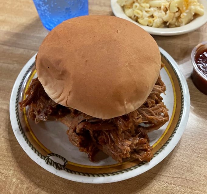 The pulled pork sandwich—where simplicity meets substance in a handheld masterpiece that makes fancy food seem unnecessarily complicated.
