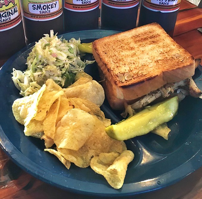The triple threat: pulled pork sandwich, homestyle beans, and potato chips. A blue plate special that would make your grandmother nod in approval.