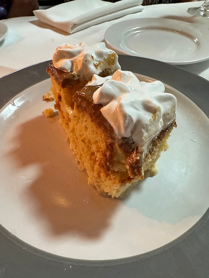 Tres leches cake that's somehow both cloud-light and decadently rich. The whipped cream on top isn't just garnish—it's the halo this heavenly dessert deserves.
