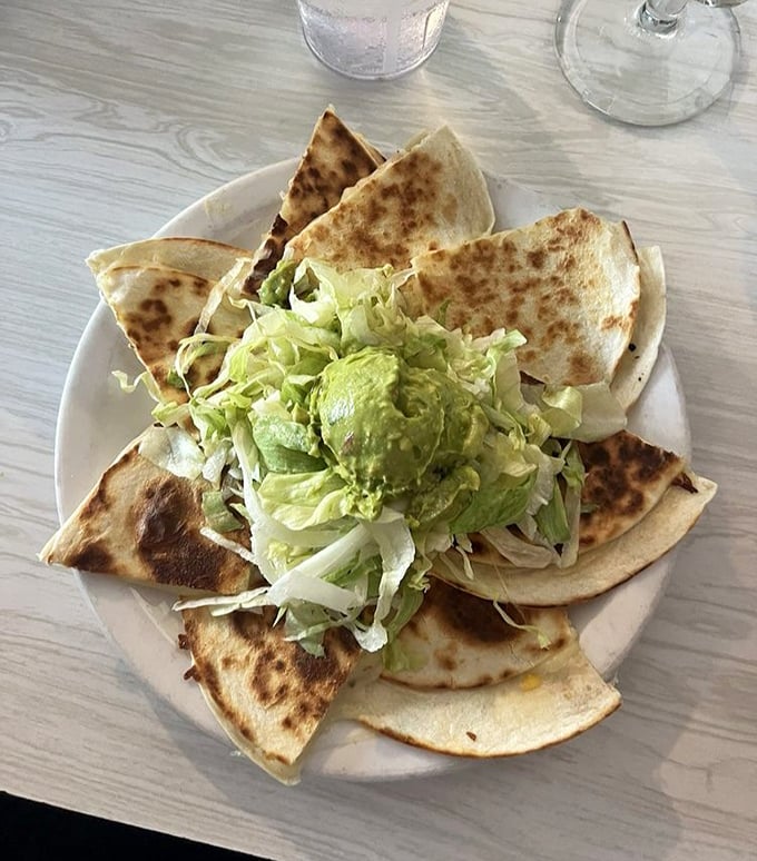 Quesadillas done right—crispy exterior, molten interior, with jalapeños adding just enough heat to make you reach for that margarita.