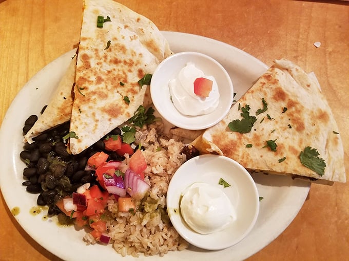 These quesadillas aren't just lunch—they're diplomatic negotiations between cultures, with cilantro, beans, and rice finding delicious common ground on a perfectly crisped tortilla.