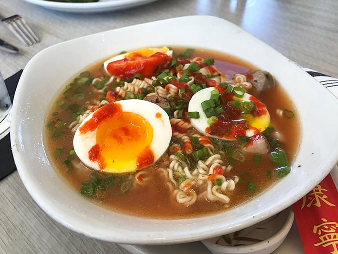 Ramen with a soft-boiled egg that's living its best life. Comfort food transcends cultural boundaries in this steaming bowl of possibility.