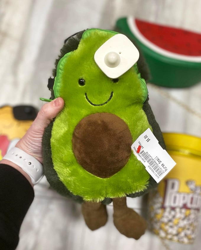 An avocado plushie with security tag intact—proof that even secondhand stores aren't immune to millennial food obsessions.