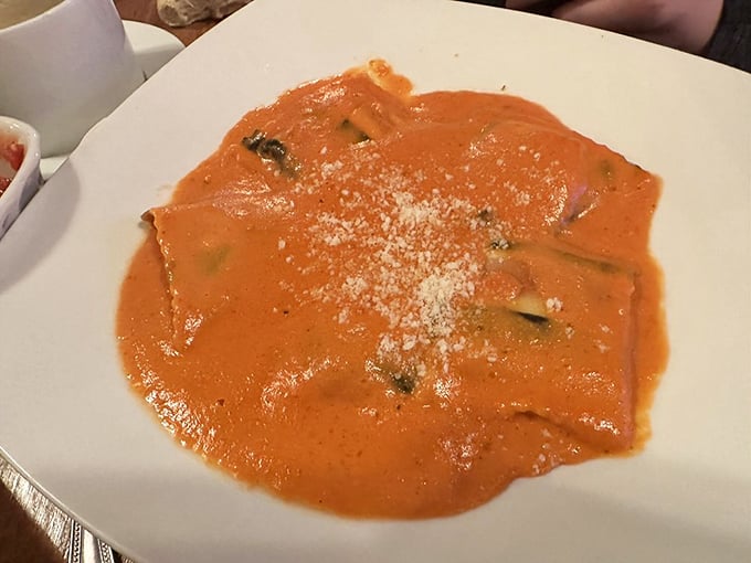 Ravioli swimming in a sunset-colored sauce that makes you want to write poetry. Or at least take another bite while contemplating sonnets.