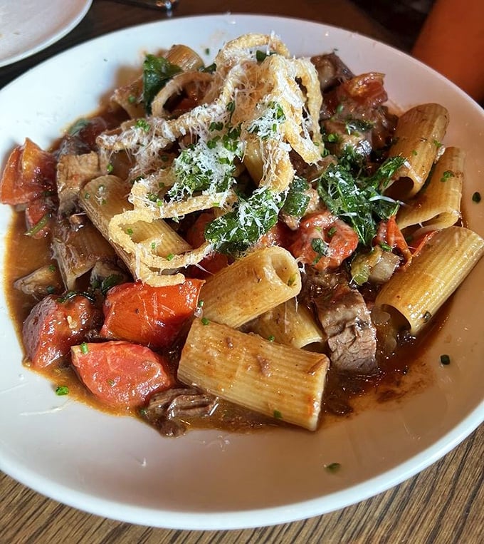 This rigatoni dish doesn't just satisfy hunger – it tells a story of slow-cooked meat, bright tomatoes, and pasta that's found its soulmate.