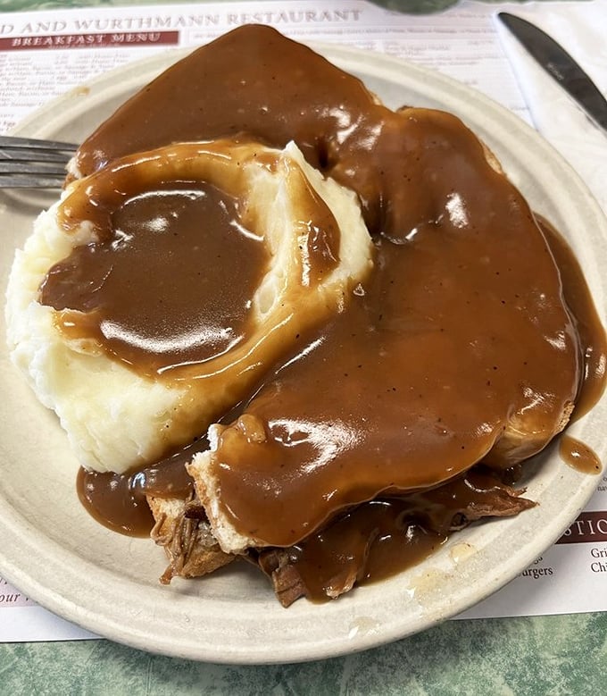 The hot roast beef sandwich—where gravy isn't just a topping but a philosophical statement about abundance. Comfort food architecture at its finest.