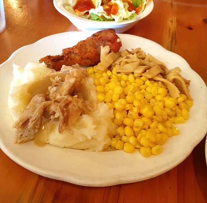 A plate that screams "Sunday dinner at grandma's"—tender roast turkey, cloud-like mashed potatoes, buttery corn, and noodles that comfort the soul.
