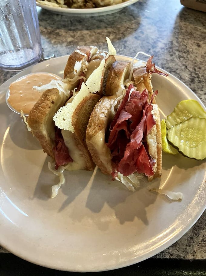 A proper Reuben sandwich that doesn't need Instagram filters – just corned beef, sauerkraut, and Swiss in perfect harmony.