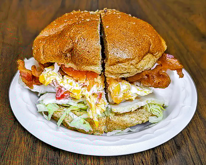 The club sandwich—architecture you can eat. Layers of flavor stacked so high they need that toothpick structural support.