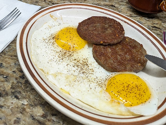 Sausage patties and sunny-side-up eggs—breakfast's dynamic duo. Simple, honest food that doesn't need Instagram filters to look good.