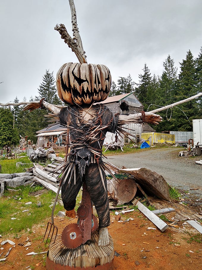 Not your average garden scarecrow—this pumpkin-headed sentinel would make even the bravest crow reconsider its life choices.