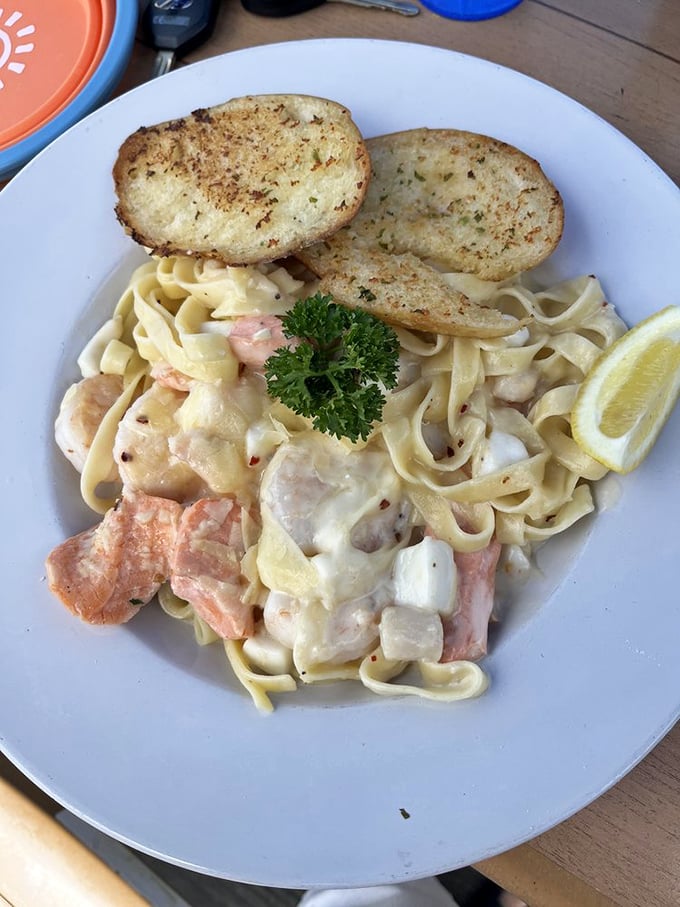 Seafood alfredo that proves pasta and ocean treasures were meant for each other—a maritime love affair in every forkful.