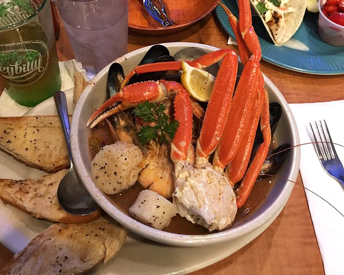 This seafood cioppino doesn't just have crab legs – they're reaching out of the bowl as if to say, "Pick me first!" A maritime treasure chest in edible form.