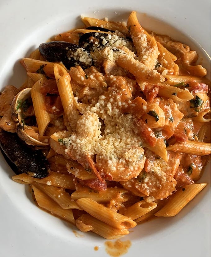 Seafood pasta that doesn't skimp on the stars—each bite delivers a perfect ratio of tender shellfish to al dente penne.