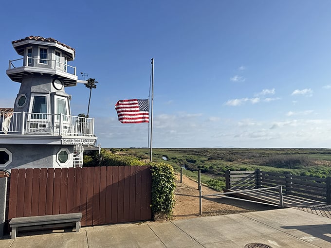 The Seaside Point Lighthouse overlooks coastal wetlands, proudly flying the American flag while symbolizing Imperial Beach’s nautical spirit and charm.