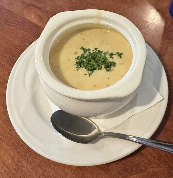 A bowl of she-crab soup that whispers, "Cancel your afternoon plans"—velvety, rich, and worthy of being sipped slowly while contemplating life's greatest mysteries.