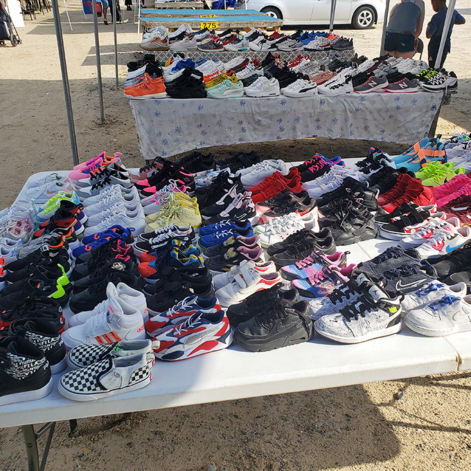 A sea of sneakers spreads across tables like a footwear festival, offering everything from athletic performance to street style at prices that won't make you wince.