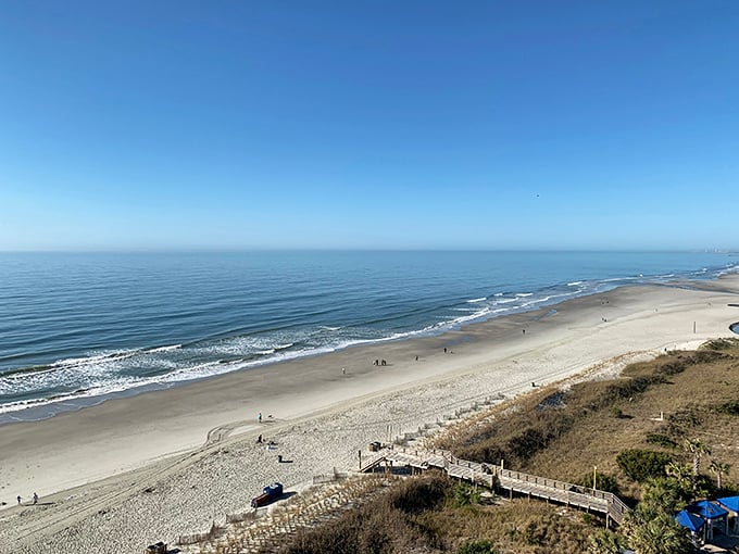 Golden hour transforms ordinary sand into a canvas of light and shadow – no filter required on Folly's natural masterpiece.