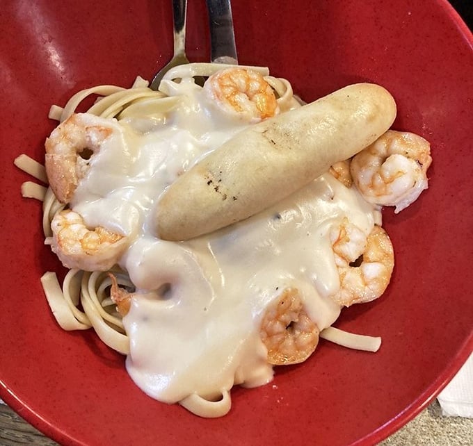 Creamy alfredo sauce blankets tender shrimp and pasta—proof that New England seafood houses know their way around Italian classics too.