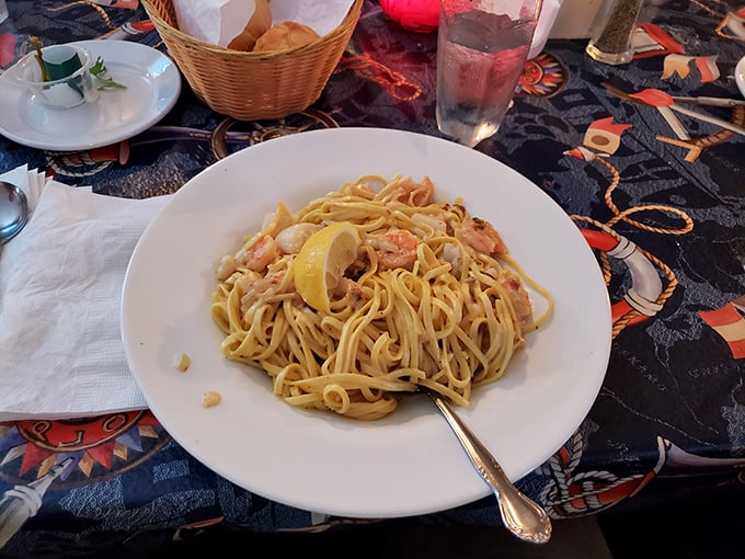 Pasta that's found its soulmate in shrimp and cream sauce. That lemon wedge isn't just garnish—it's the bright note that ties the whole symphony together.