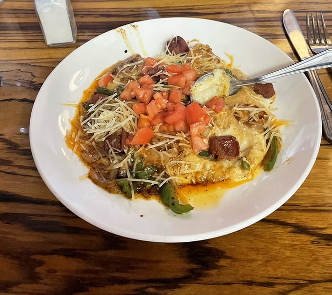 A Southern symphony on a plate – shrimp and grits elevated with fresh tomatoes and cheese that would make even a Charleston blue blood swoon.